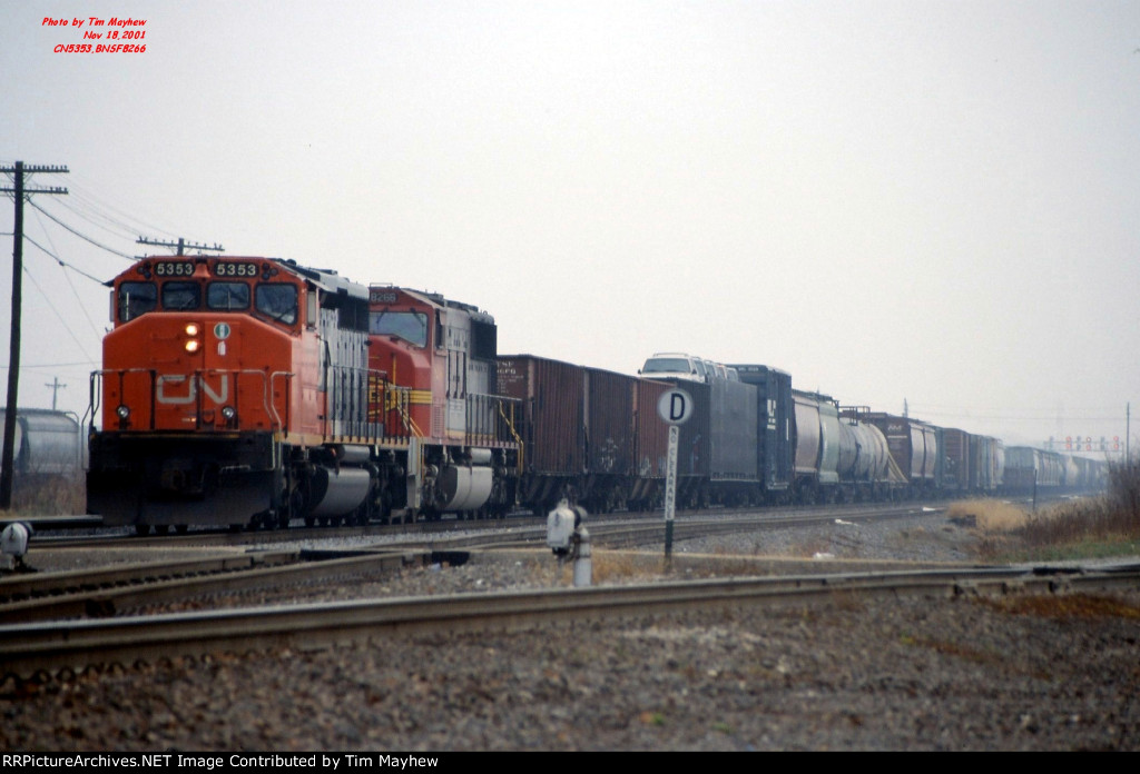 CN 5353 West with BNSF 8266 , Eola Yard Illinois